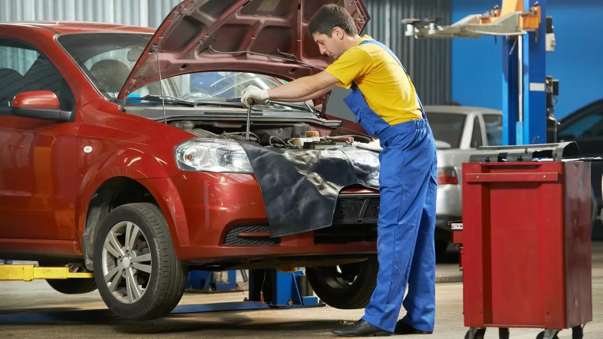 auto mechanic at work with wrench