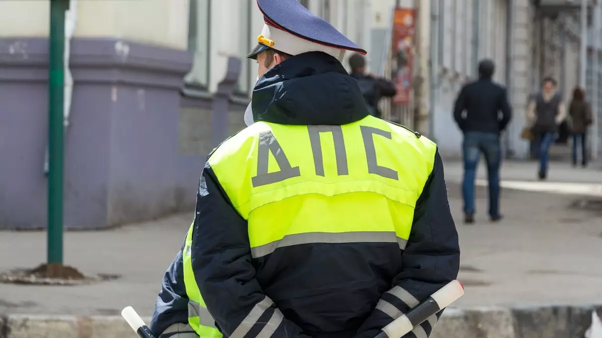 Russian police officers standing by the road in lime-colored uniform